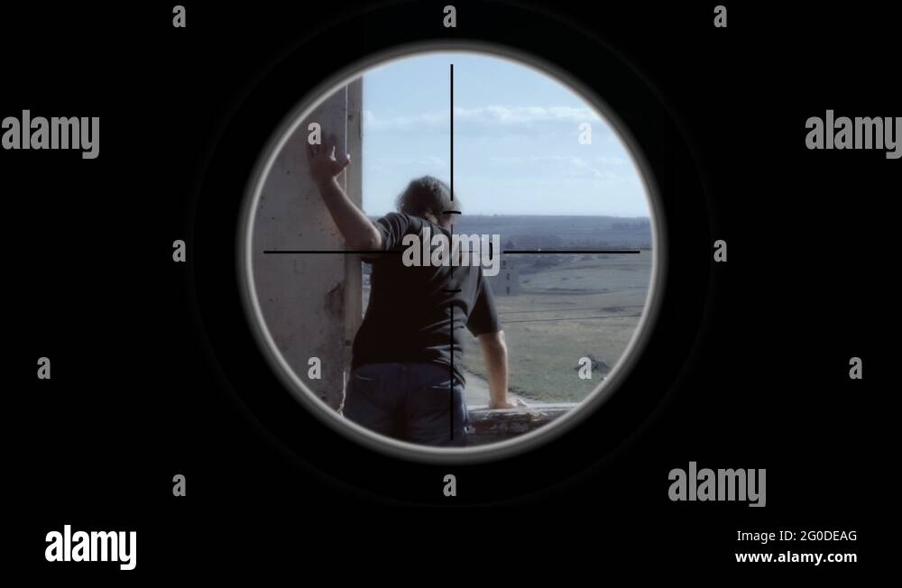 Sniper scope abandoned house man window Stock Video Footage - Alamy
