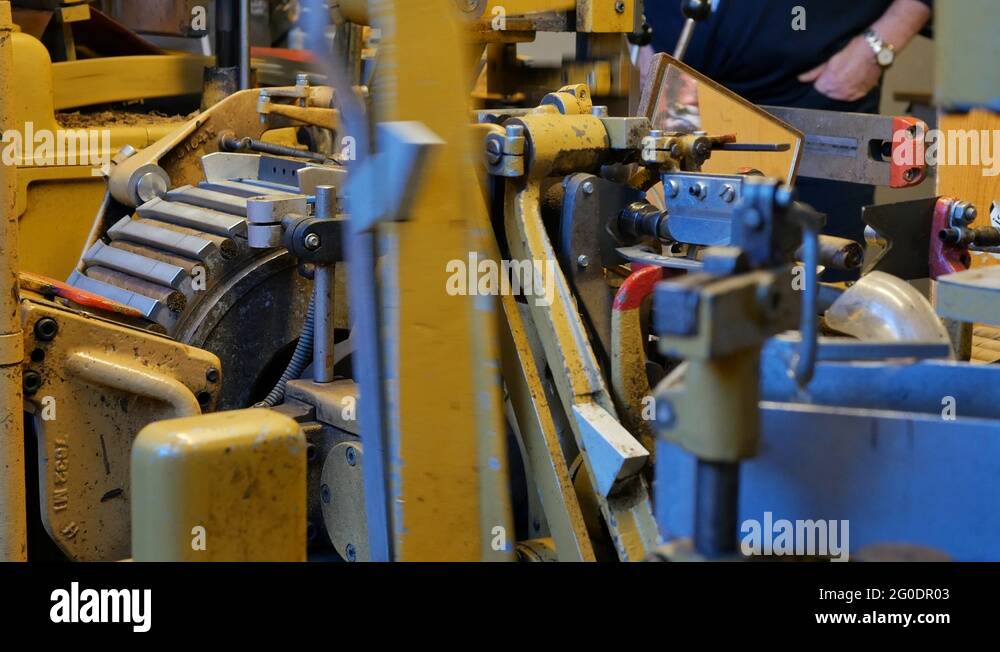 Cigar rolling machine inside a cigar factory producing homemade cigars ...