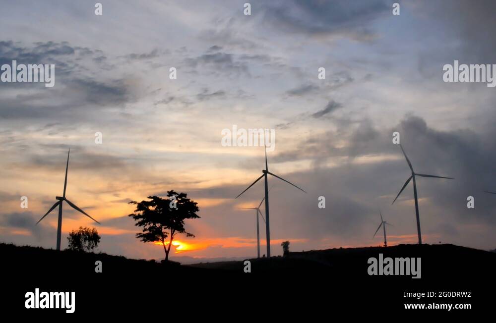 4K beautiful wind turbine in twilight sundown. Concept of renewable ...