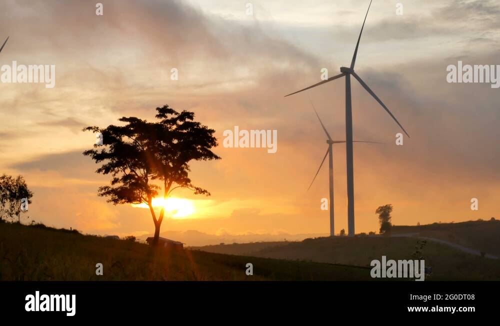 4K beautiful wind turbine in twilight sundown. Concept of renewable ...
