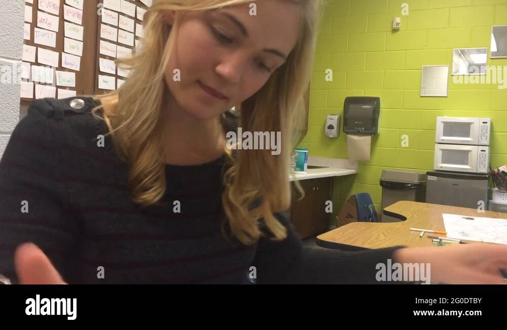 Teacher grading homework in classroom Stock Videos & Footage - HD and ...