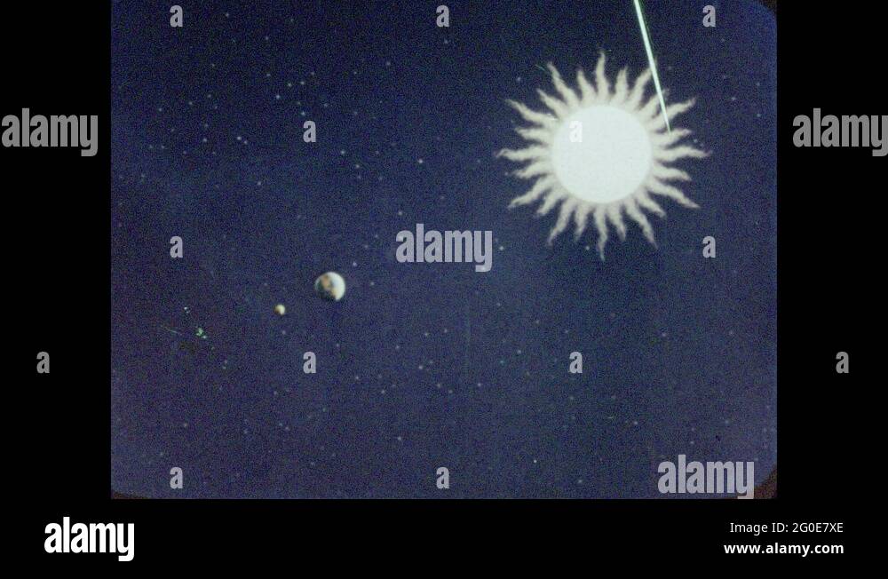 1950s: The sun, the Earth, and its moon from space. Zooms in on the ...