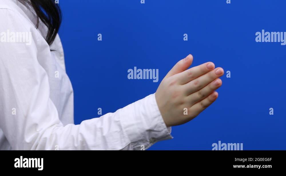 Female hand showing push screen gestures on blue screen : Virtual ...