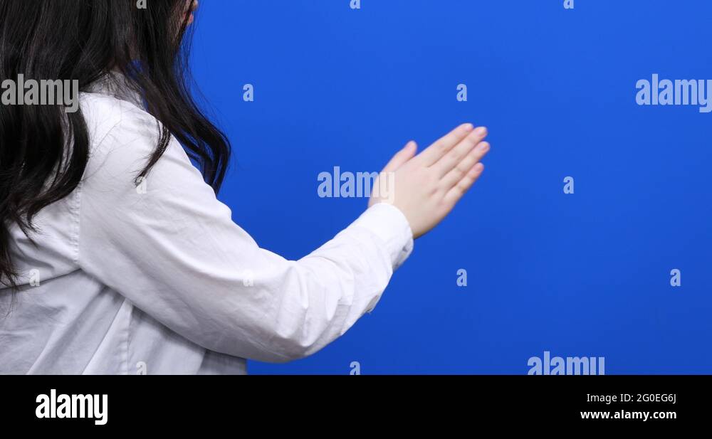 Female hand showing push screen gestures on blue screen : Virtual ...