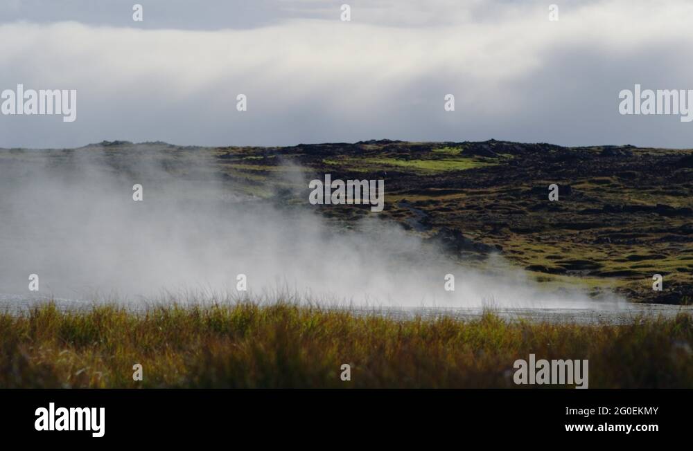 Steam Billows Out From Geyser In Beautiful Green Volcanic Icelandic ...