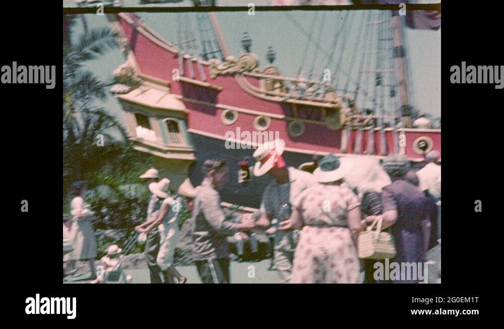 1950s: Crowd at Jolly Roger pirate ship at Disneyworld. Crowd at whale ...