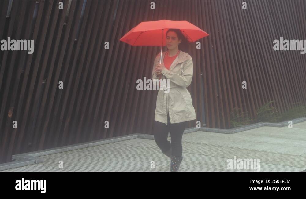 Wind umbrella woman Stock Videos & Footage - HD and 4K Video Clips - Alamy