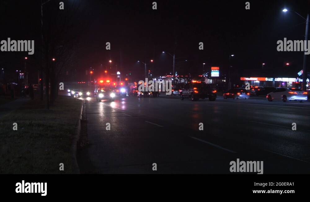 Accident at night in city intersection with ambulance and police at ...
