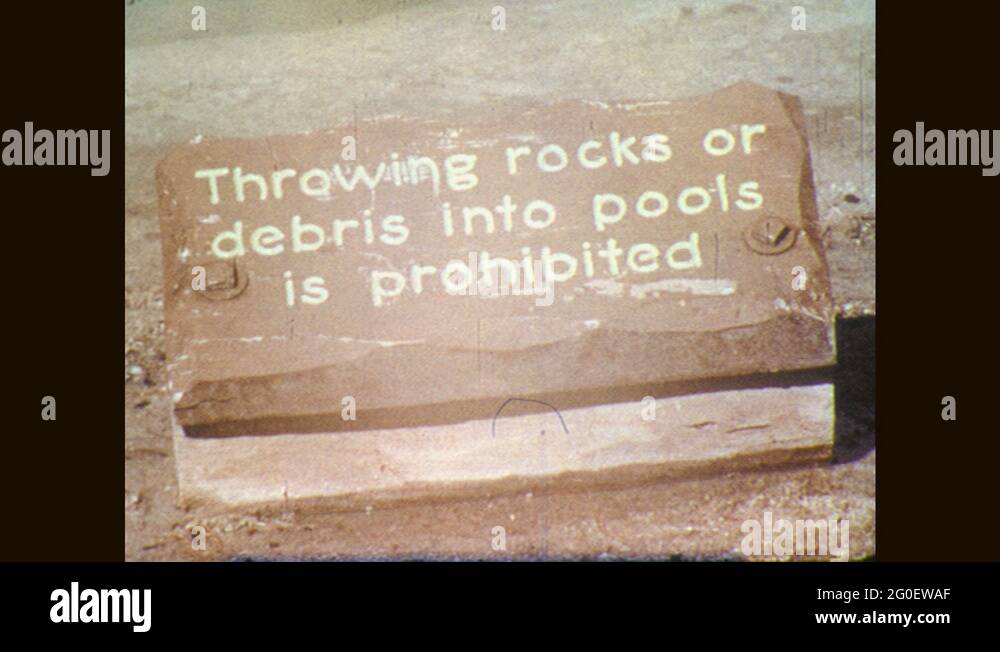 1960s: Sign reading "Throwing rocks or debris into pool is prohibited ...