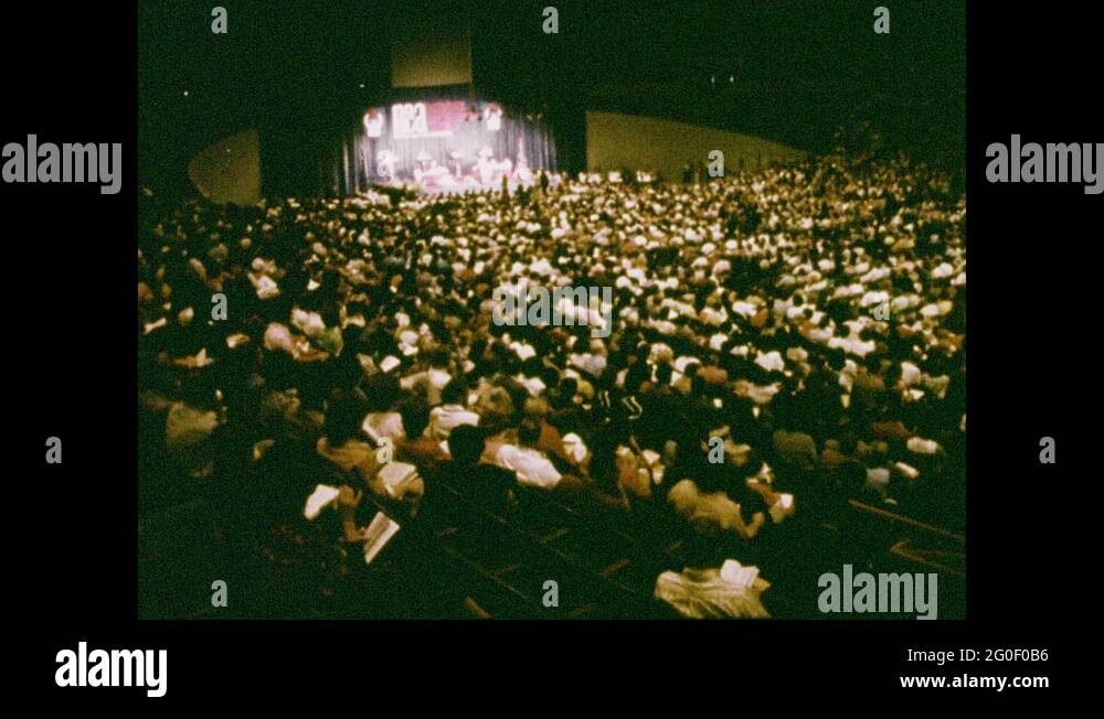 1970s: UNITED STATES: people at conference. Speakers at education ...