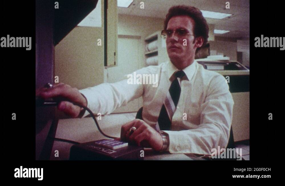 1980s: Man working at computer. Computerized drawing of car. Man at ...