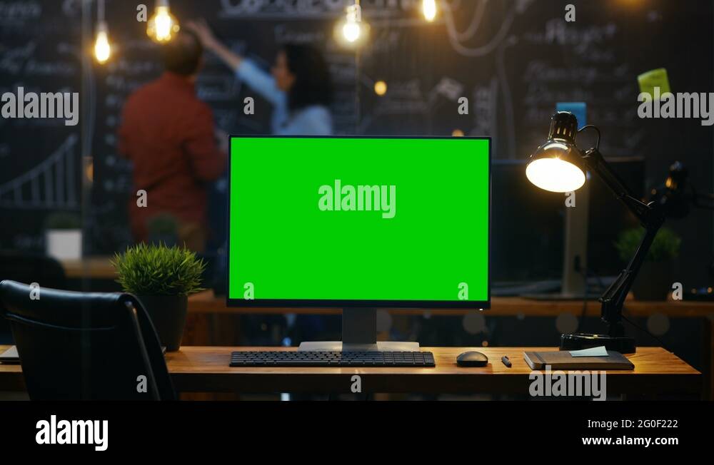Personal Computer with Mock-up Green Screen Monitor Stands on the ...