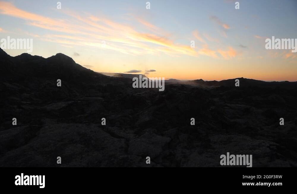 Volcanic fields covered with lava and rock. Slow Motion Footage Stock ...