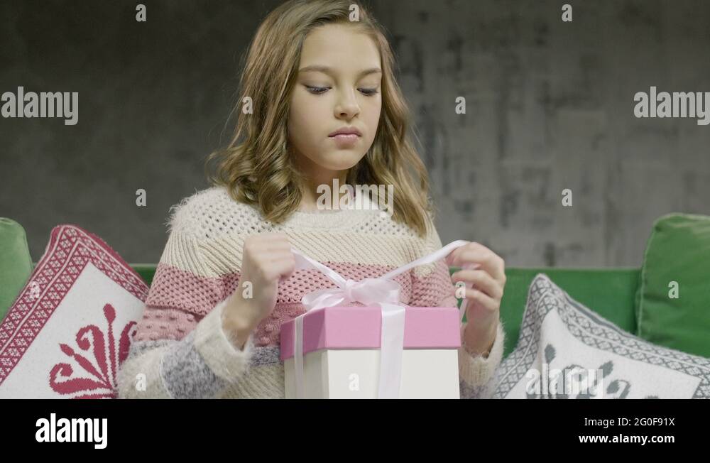 Unhappy sad teenage girl sitting open gift box Stock Video Footage - Alamy