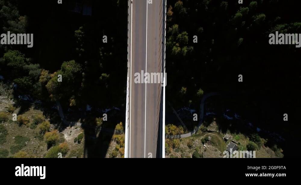 Alpine bridge, Cinema 4k aerial rising view above a big bridge between ...