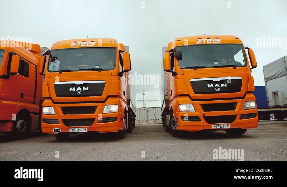 Driver starts motion of the cargo TIR transportation truck from parking ...