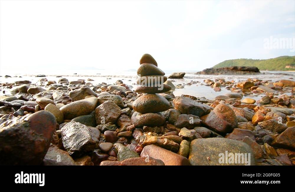 4K Rock stack balance and harmony on sea beach Stock Video Footage - Alamy