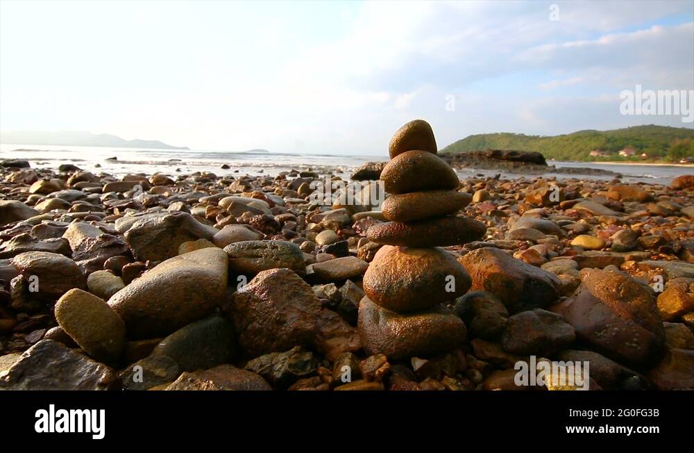 4K Rock stack balance and harmony on sea beach Stock Video Footage - Alamy