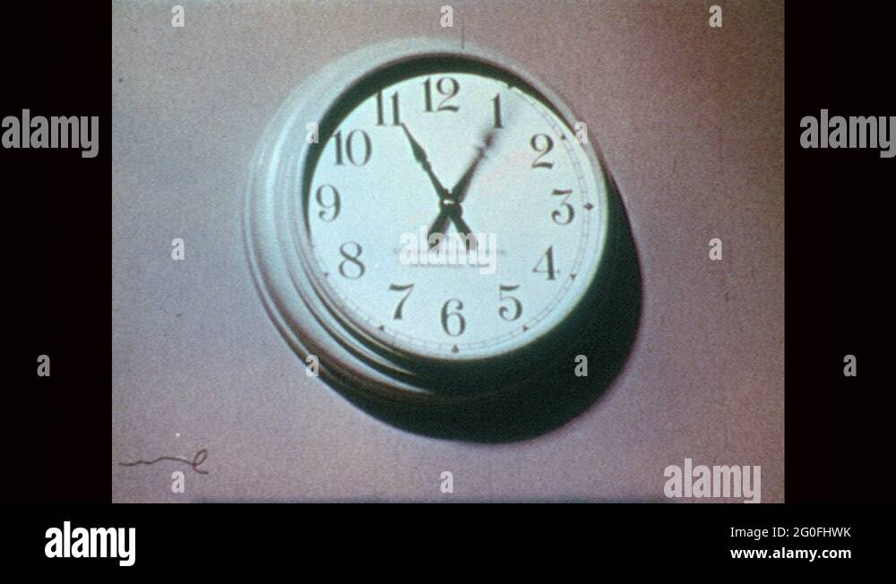 1950s-united-states-clock-hands-move-fast-black-and-yellow-fallout-out-sign-stock-video