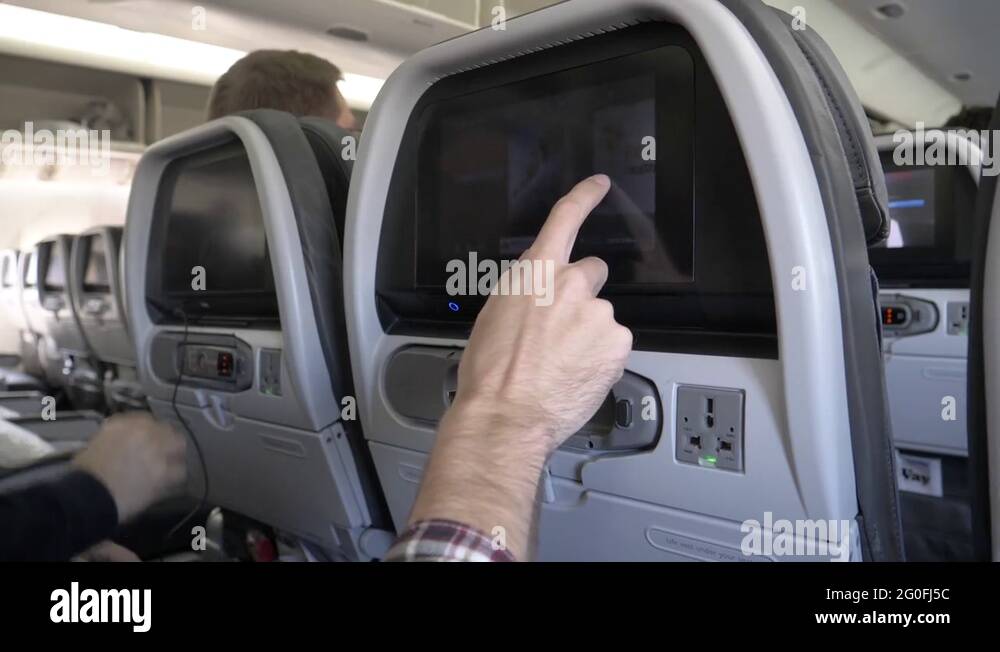 Airplane Passengers Using The Touchscreen Panel Infront of Them Boeing ...