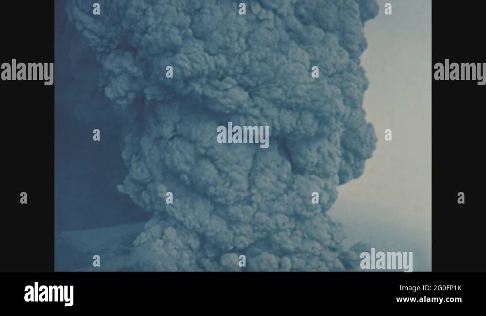 Dark clouds of ash and hot gases spreading in the air after volcanic ...