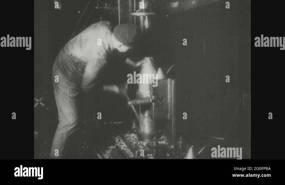 Female factory worker drilling and polishing shell in factory - 1918 ...