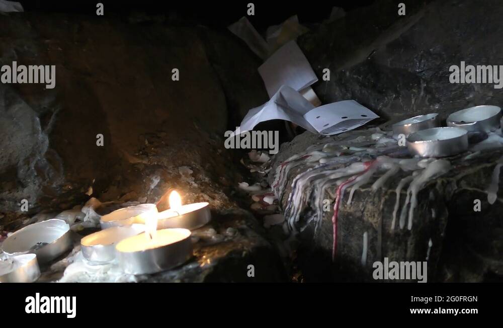 People light candles and leave notes with prayers in Rabbi Rashbi cave ...