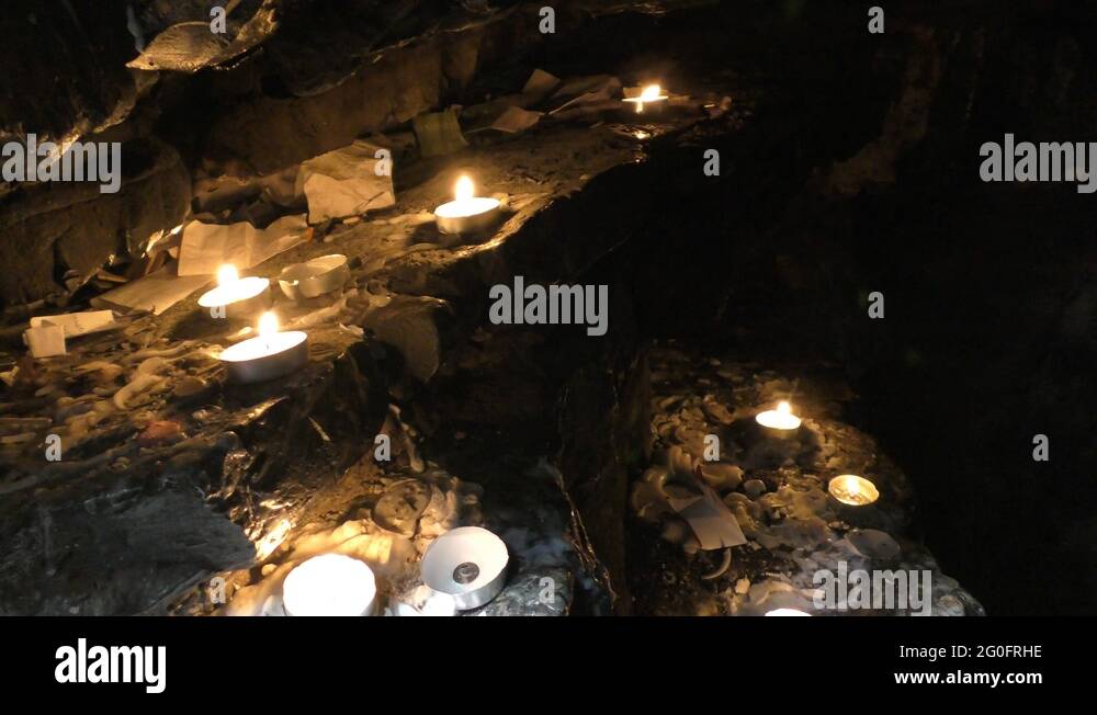 People light candles and leave notes with prayers in Rabbi Rashbi cave ...