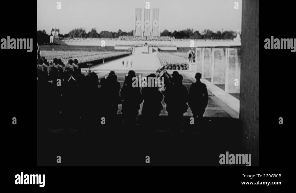 Hitler walking on the high stage with two officials - 1934 - 1940 Stock ...