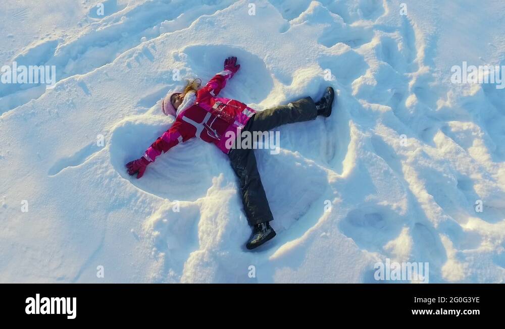 Girl playing in snow Stock Videos & Footage - HD and 4K Video Clips - Alamy