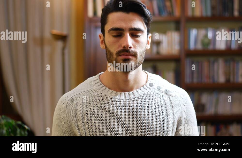 Handsome young man covering his mouth with hand Stock Videos & Footage ...