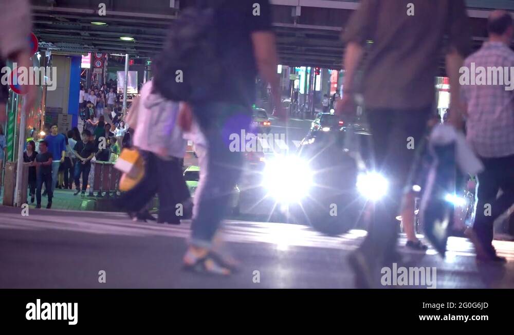 People cross the famous intersection in Shibuya, Tokyo, Japan Stock ...