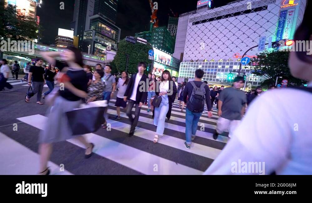 People cross the famous intersection in Shibuya, Tokyo, Japan Stock ...