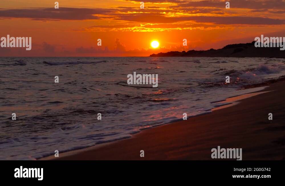 Beautiful sunset at the beach, amazing colors, light beam shining ...