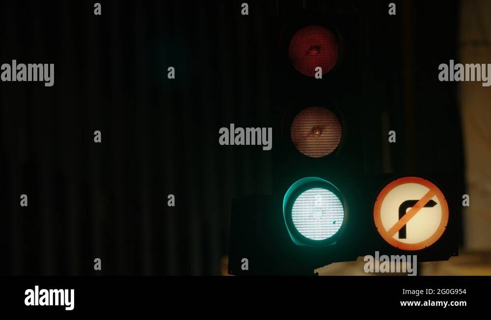 Traffic colours change from red to green at night Stock Video Footage ...