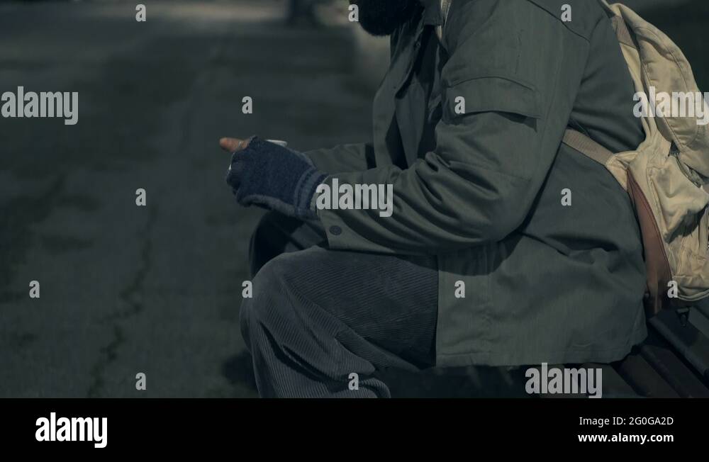 Homeless on a bench Stock Videos & Footage - HD and 4K Video Clips - Alamy