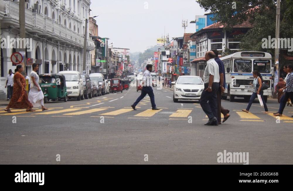 Typical urban intersection with pedestrians and vehicle traffic in ...