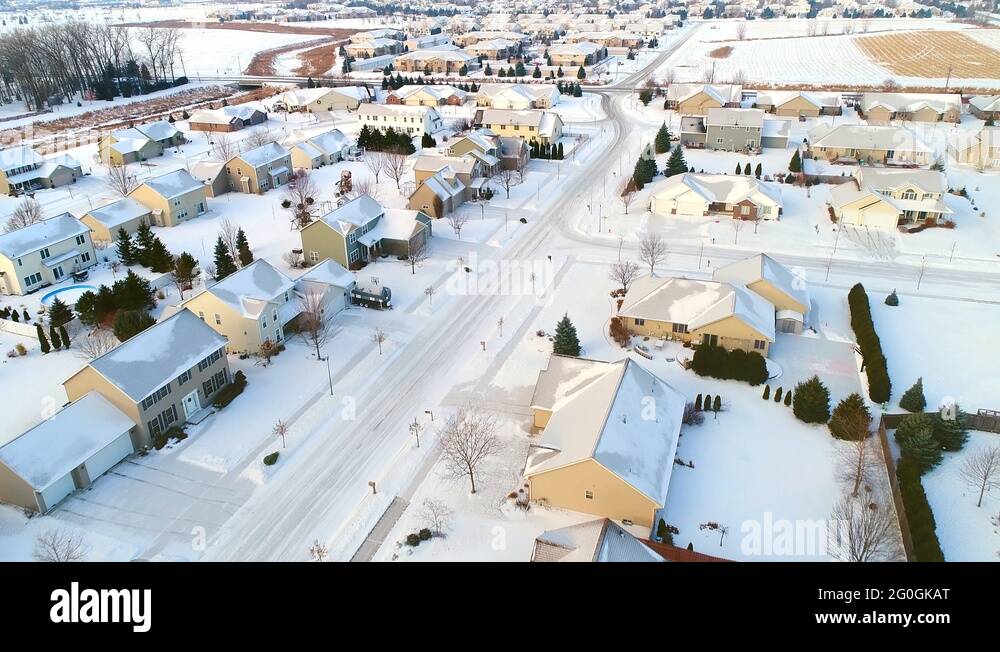 Beautiful neighborhoods, homes frozen under snow and ice, aerial view ...
