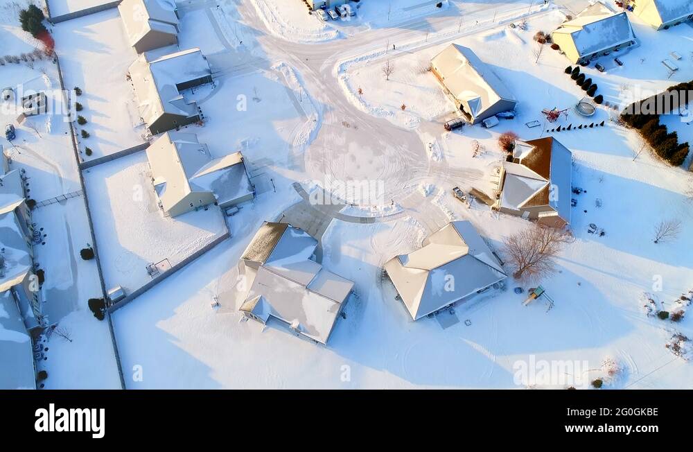 Beautiful neighborhoods, homes frozen under snow and ice, aerial view ...