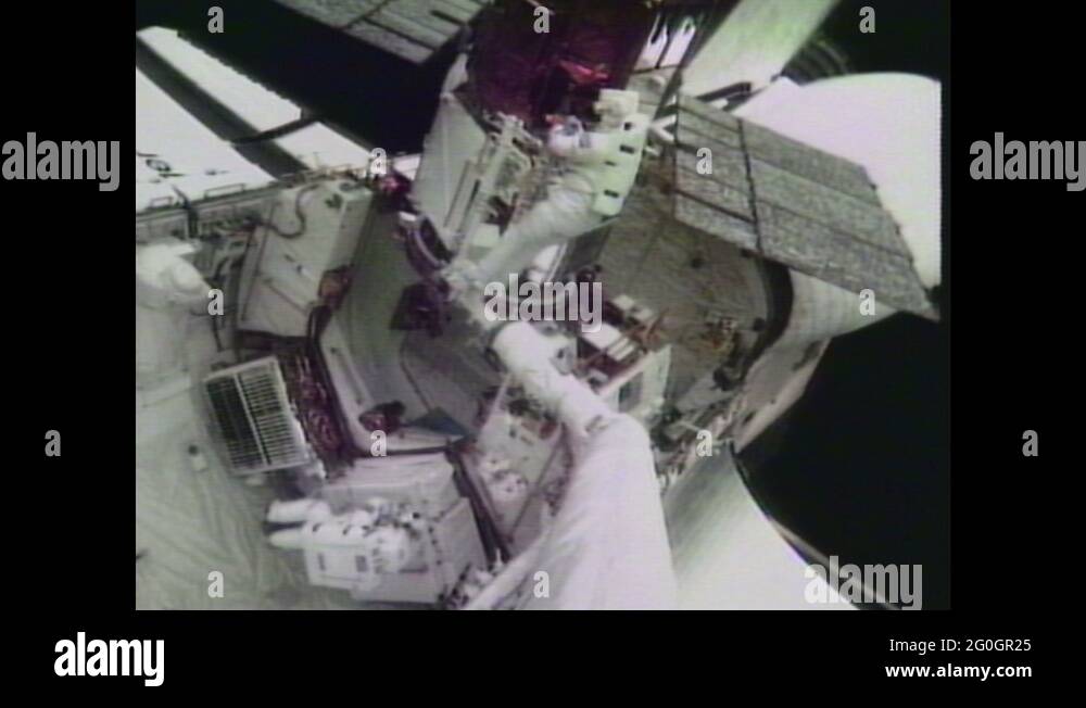 1980s: Astronauts work in docking bay of Space Shuttle, in space. Space ...