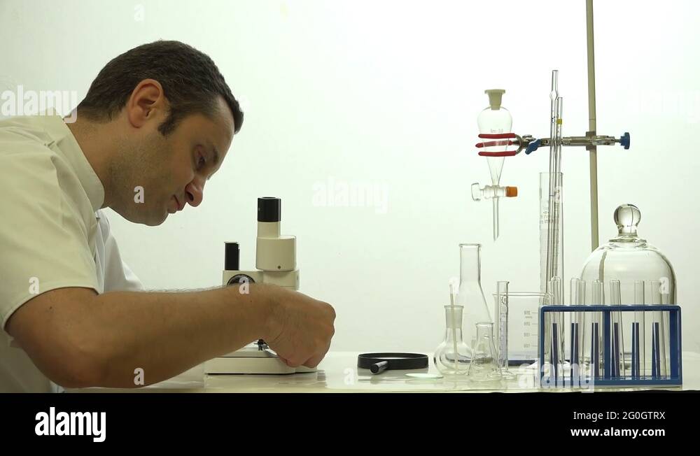 Man looking through microscope Stock Videos & Footage - HD and 4K Video ...