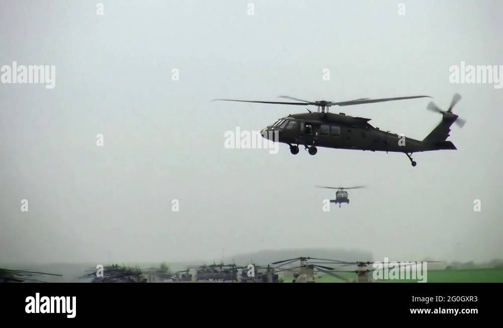 Military helicopter landing on an open ground on a pleasant day - 2017 ...