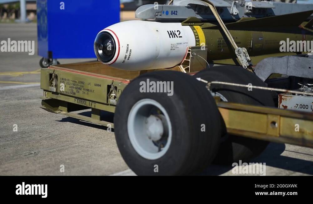 Airmen unloading weapons from tow tractor at Tyndall Air force Base ...