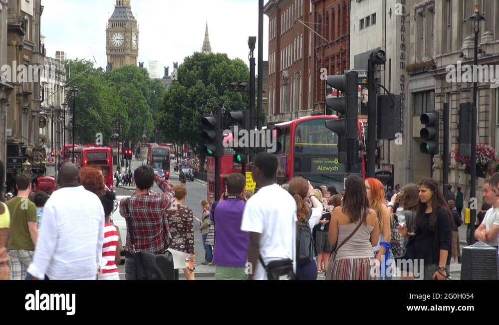 Timelapse busy London street by day red bus traffic in downtown Big Ben ...