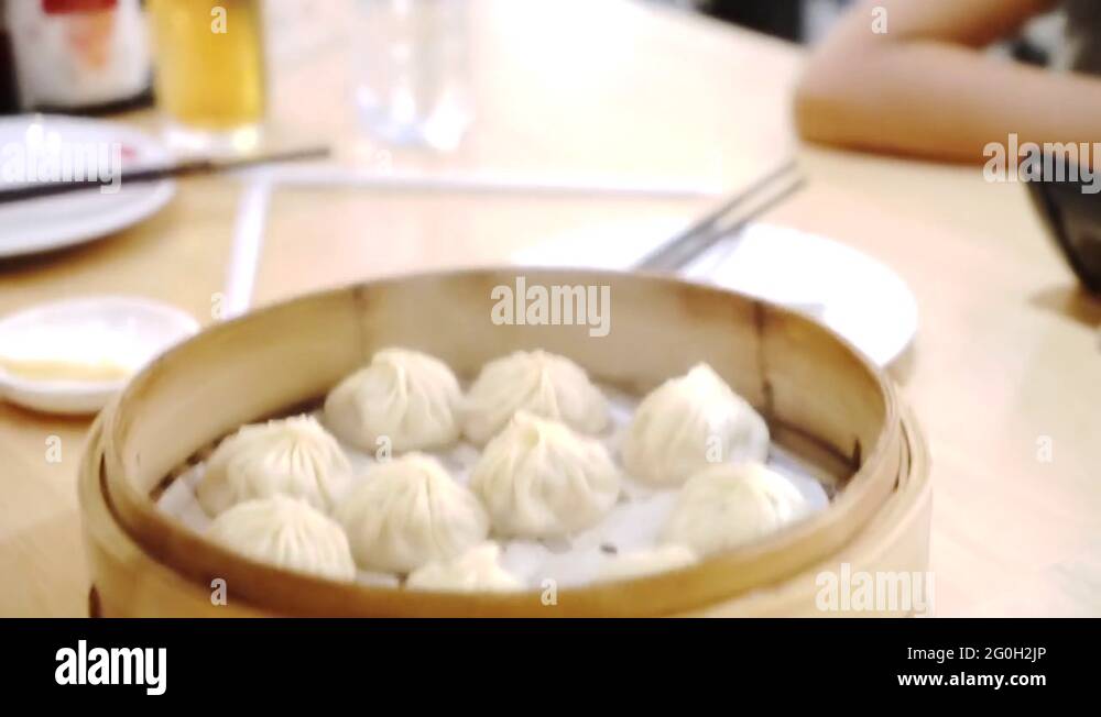 Chinese steamed dim sum in bamboo containers Stock Video Footage - Alamy