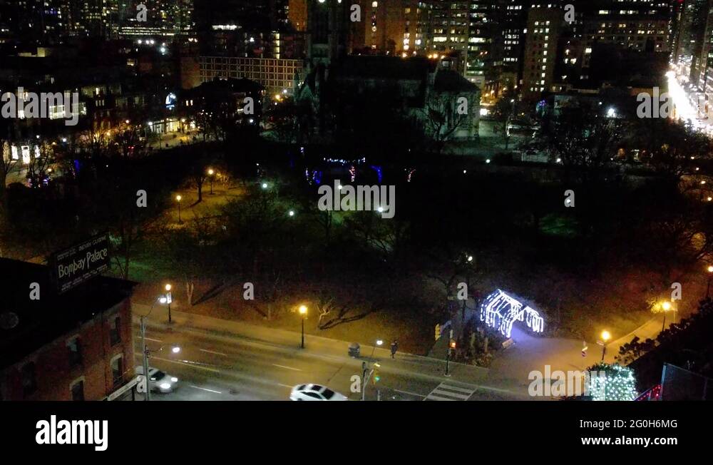 Grainy Static shot of a downtown Toronto Park at night in the winter ...