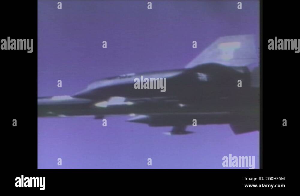 1970s: UNITED STATES: plane cruising in sky. Overhead view of plane in ...