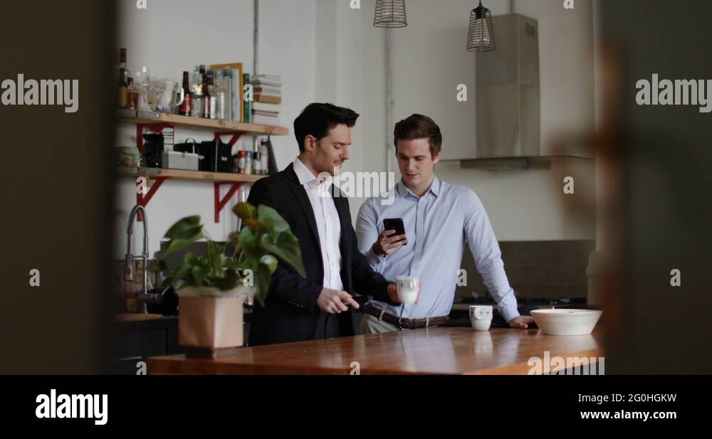 Young male couple kissing goodbye in the morning Stock Video Footage ...