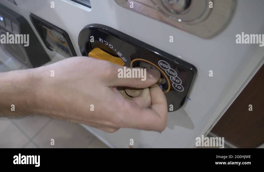 Inserting Coins into a Vending Machine Stock Video Footage - Alamy