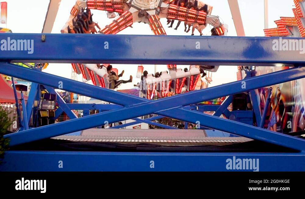 Under a pendulum ride at an amusement park with a speed ramp Stock ...